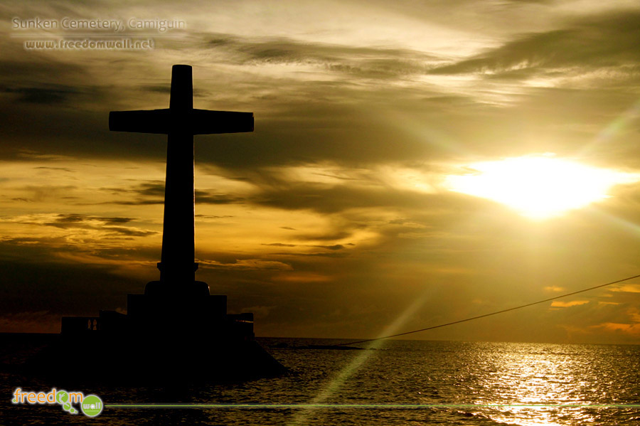 Engrossed in Camiguin's Sunken Cemetery | Freedom Wall